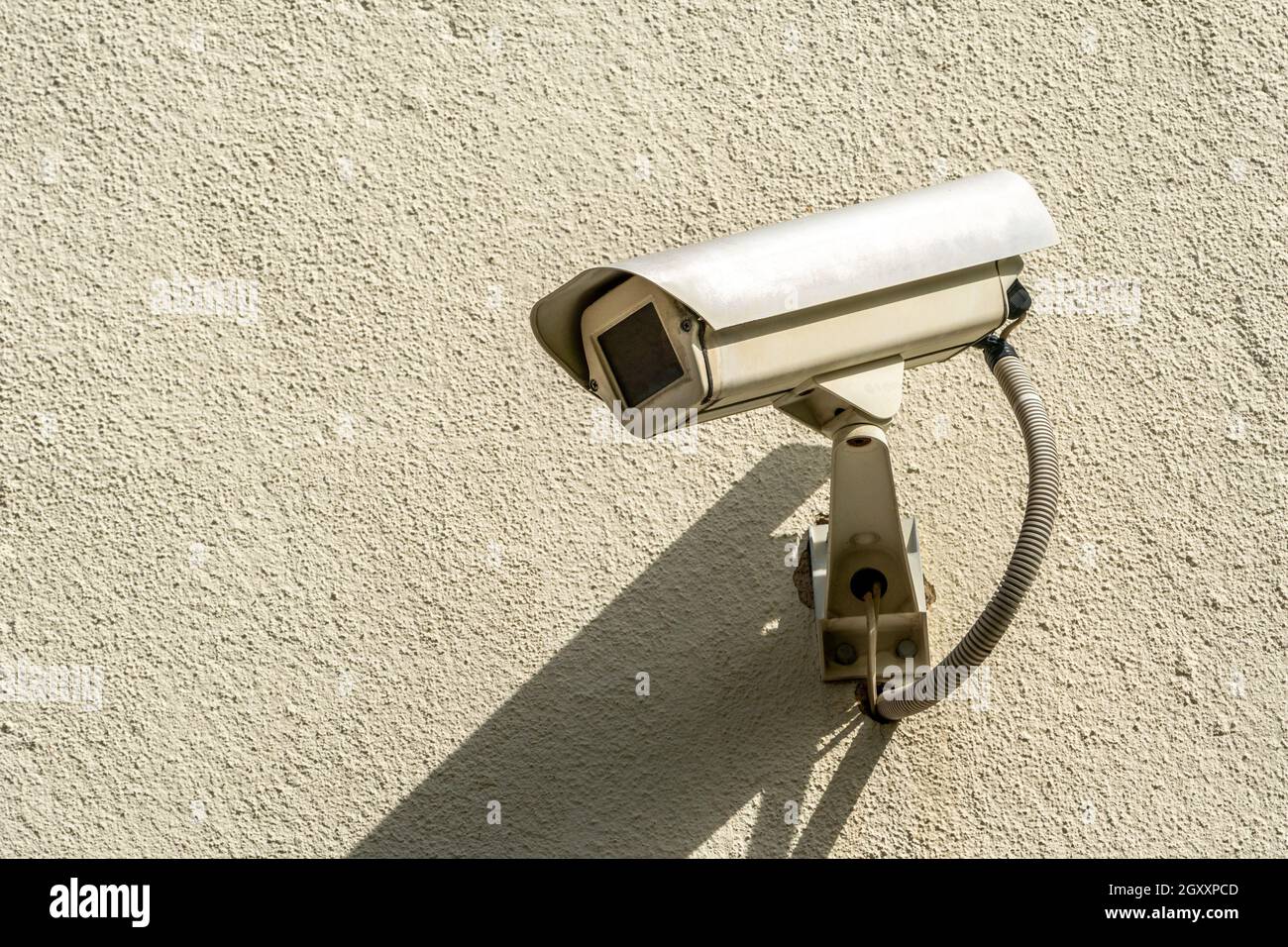 CCTV Camera on grey concrete wall with copy space. Security against ...