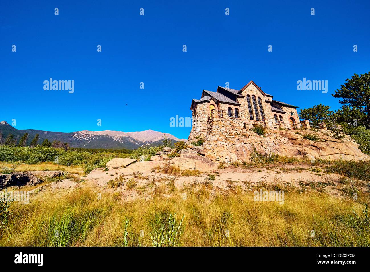 Christian religious church stone building in desert alone by mountains ...