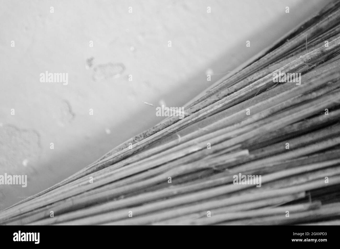 Lined up sticks standing against the wall abstract background wallpaper ...