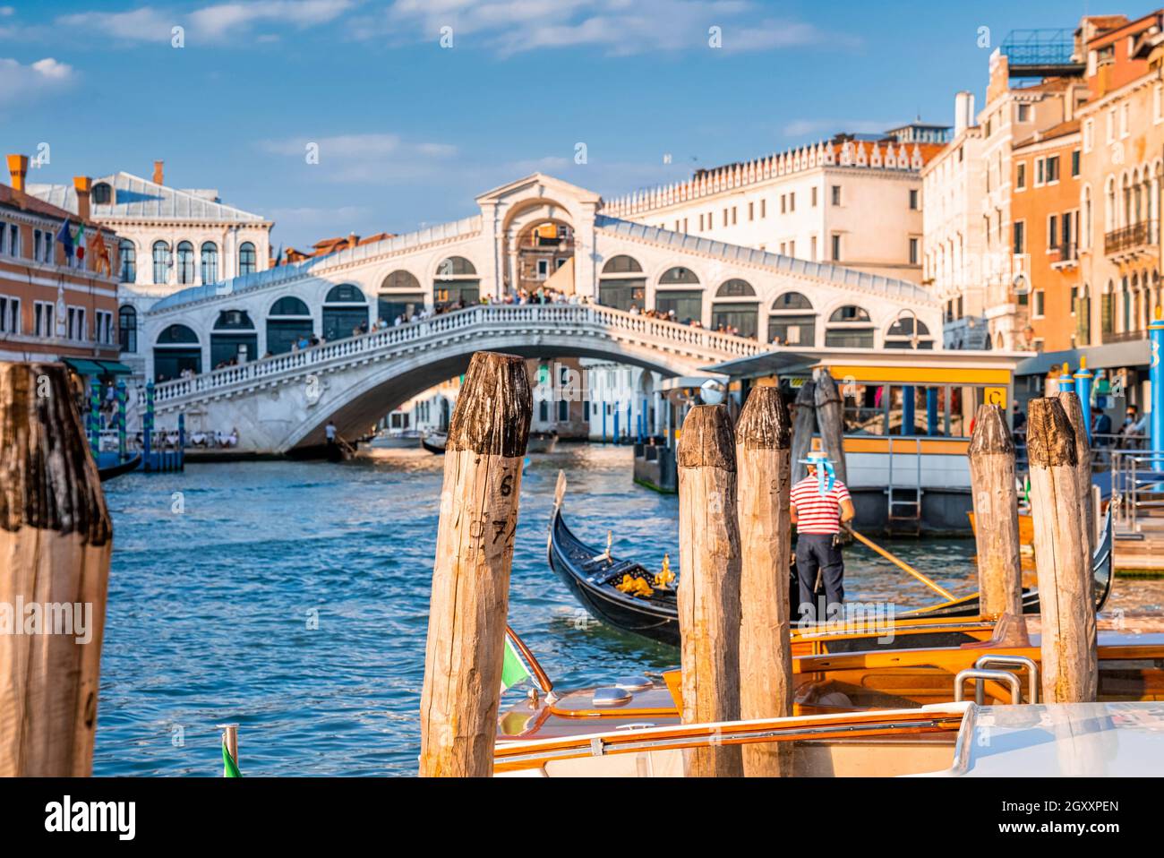 Traditional Gondola Near World Famous Canal Grande And Rialto Bridge