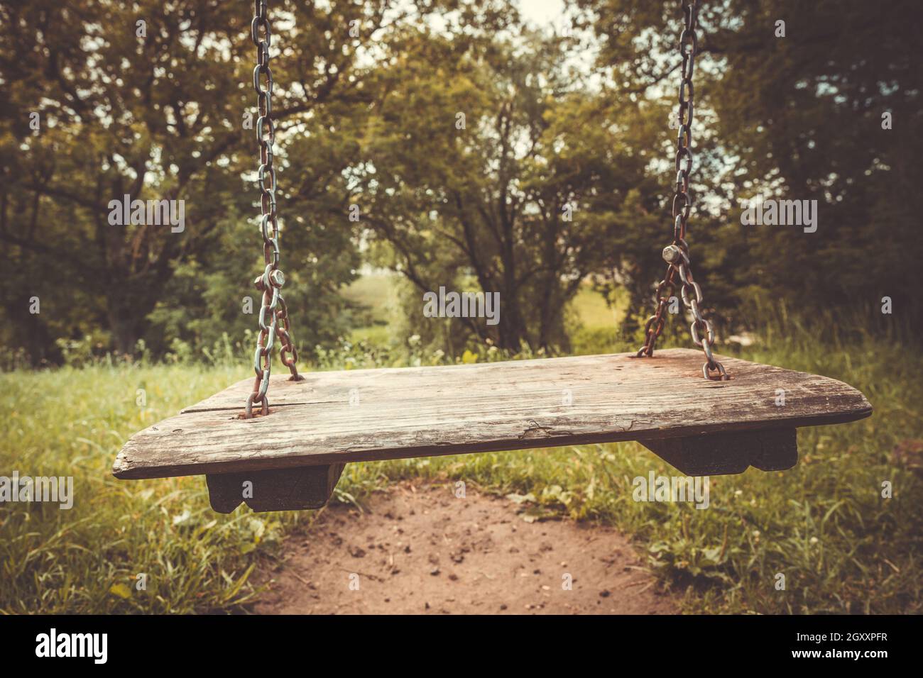 Retro style empty chain swing. An abandoned, lonely sad autumn story ...