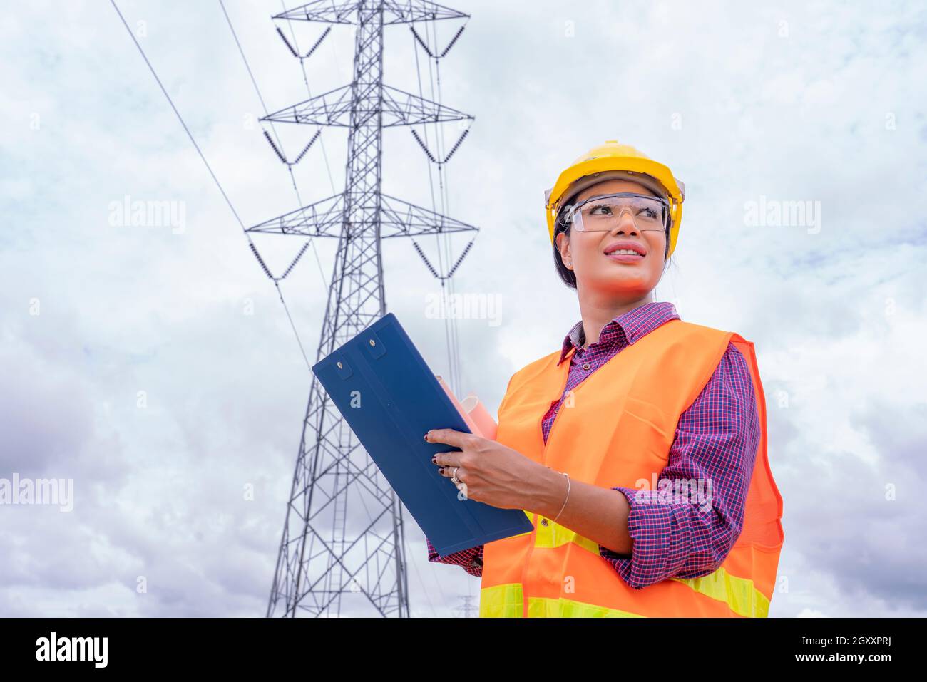 Woman engineers construction worker checking layout on digital ipad or ...