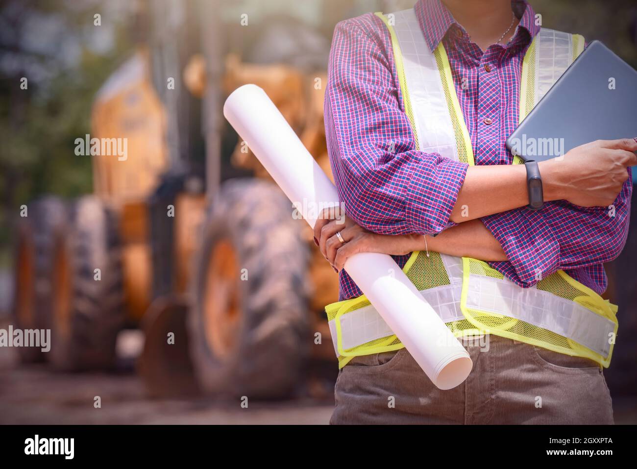 Woman engineers construction worker checking layout and digital ipad ...
