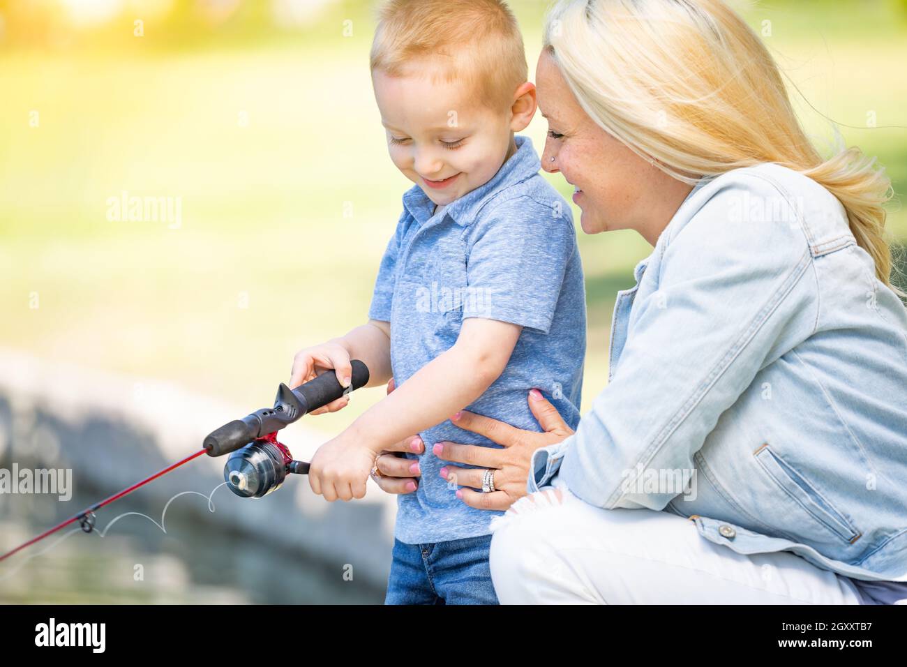 Mother and son fishing hi-res stock photography and images - Alamy