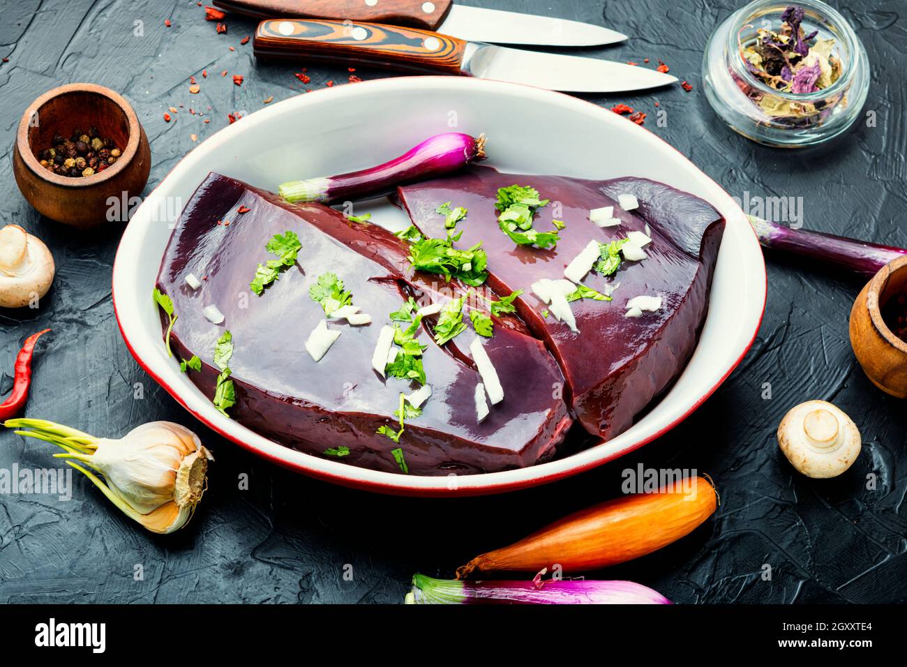 Piece of raw beef liver on the kitchen table.Fresh liver for cooking ...