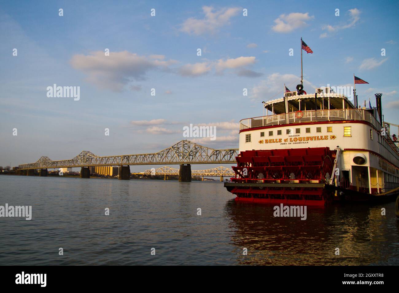 Large red and white ferry boat going under a steel bridge Stock Photo ...