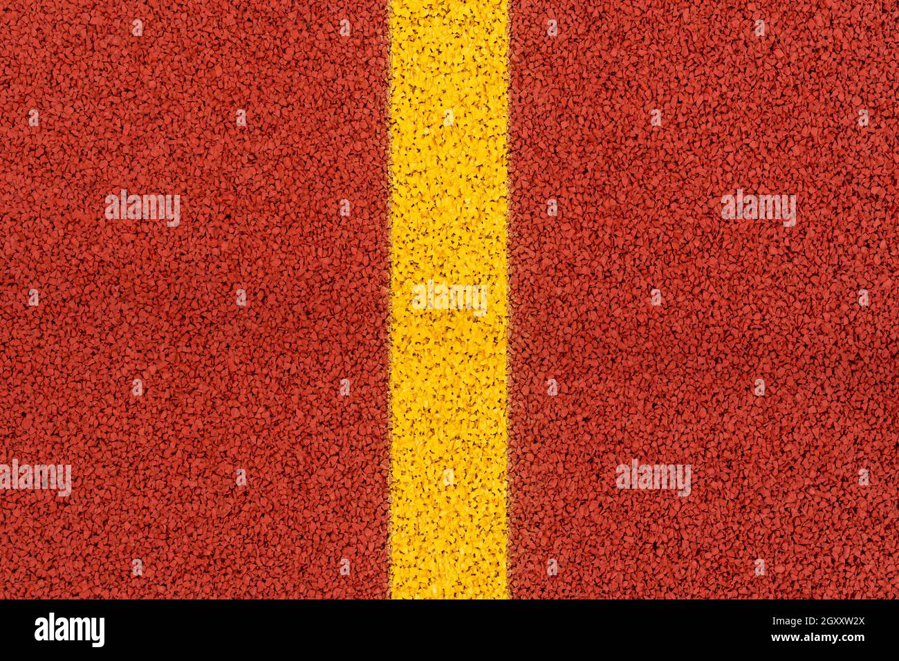 Closeup of the yellow line on red stadium running track Stock Photo - Alamy