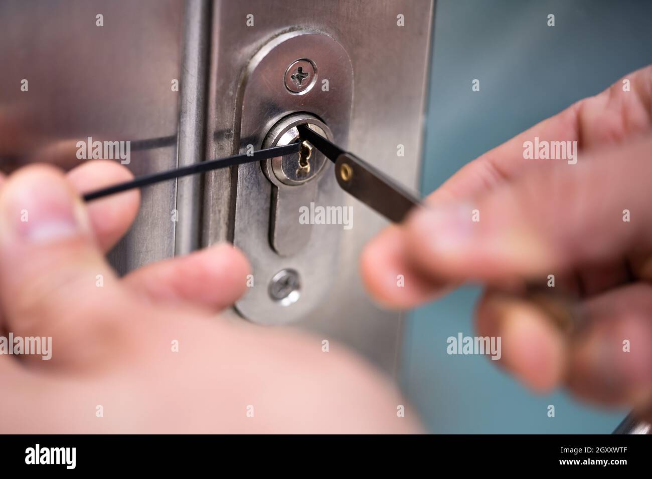 Locksmith Man Fixing Door Lock. Lockpicker Technician Stock Photo - Alamy