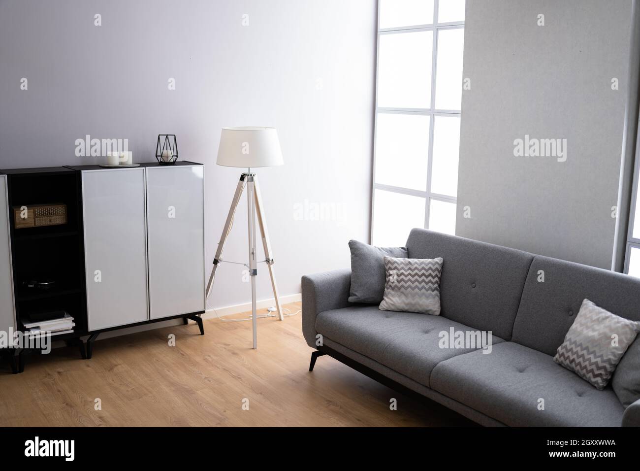 Living Room Interior With Wooden Floor And Sofa Stock Photo - Alamy