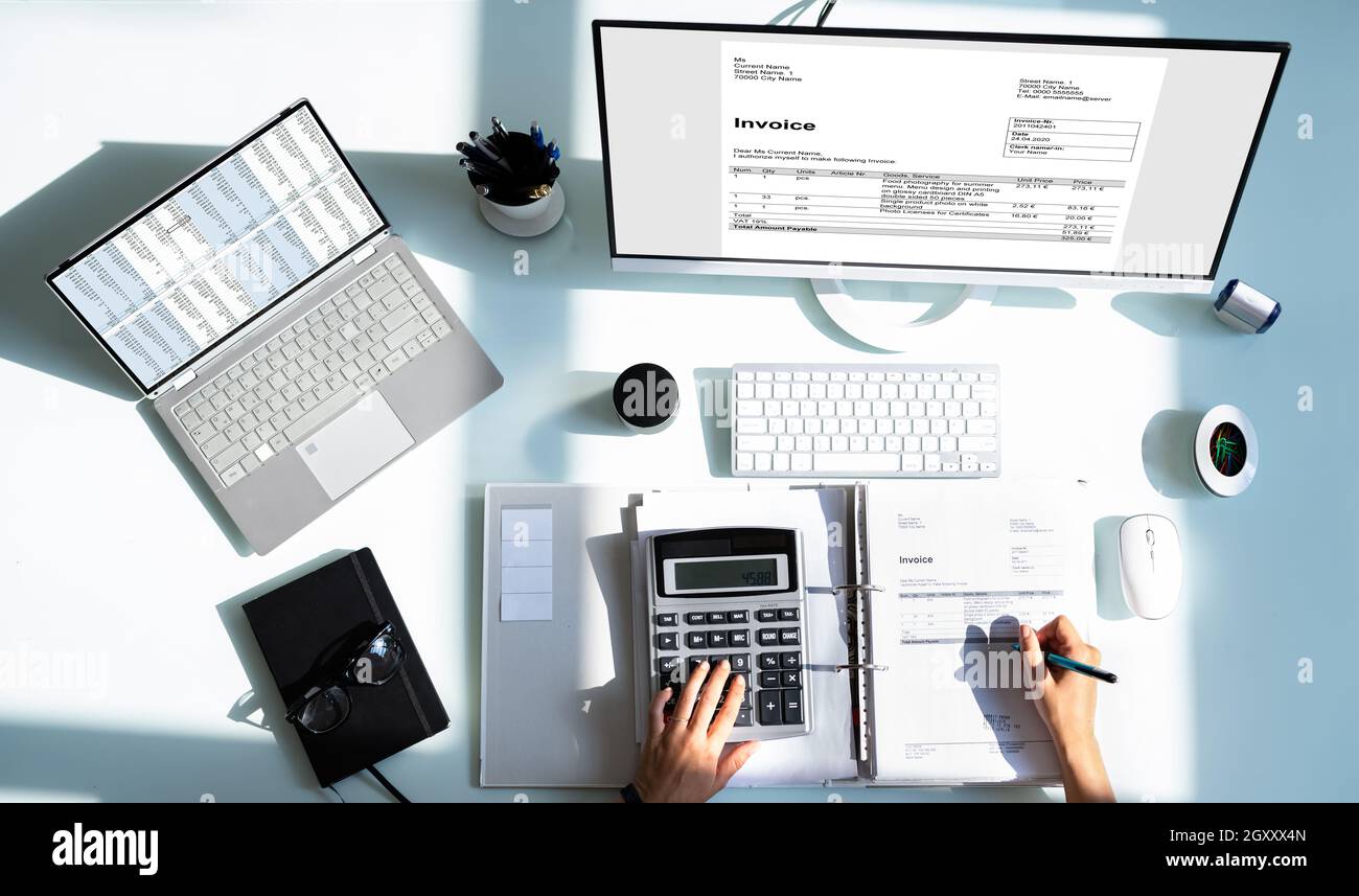 Accountant Using Calculator And Computer For E Invoice Audit Stock ...