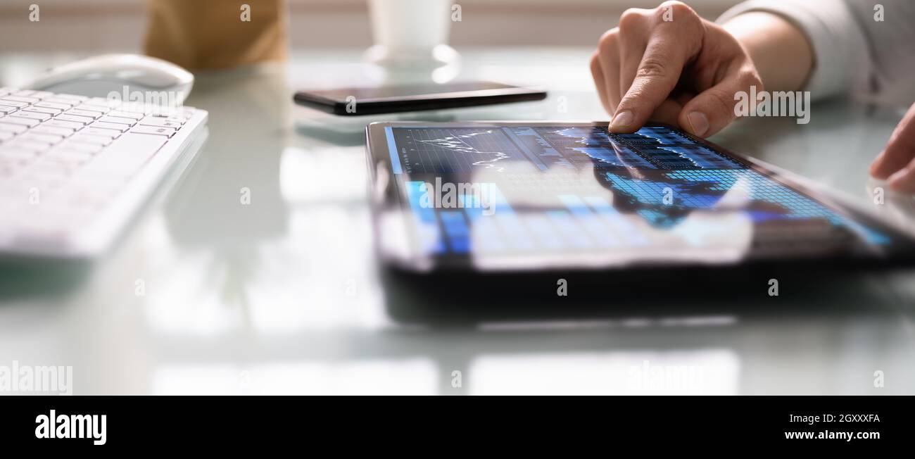 Investor KPI Analytics Graph. Hand Pointing At Data Stock Photo - Alamy