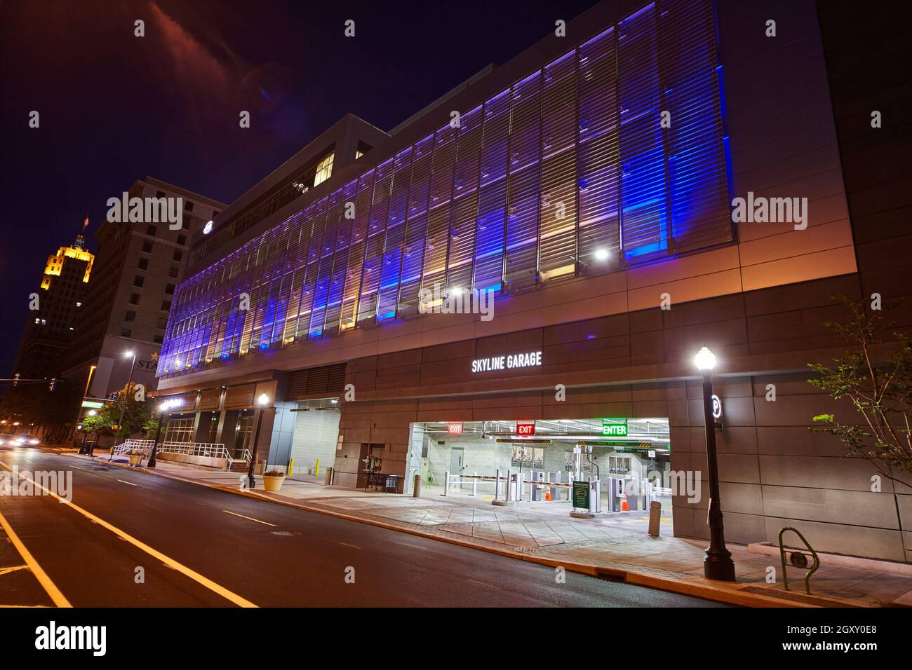 Large parking garage downtown city at night with blue lights Stock ...