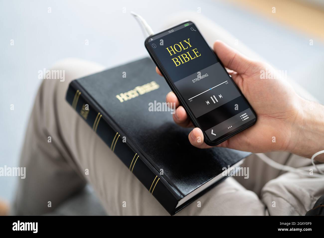 Preacher Listening Bible On Phone. Praying With Headphones Stock Photo ...