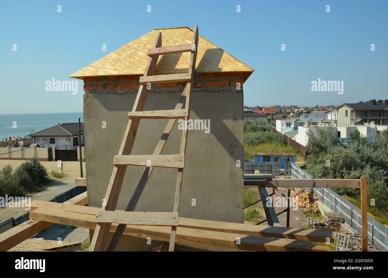 Installing roof on the chimney Stock Photo - Alamy