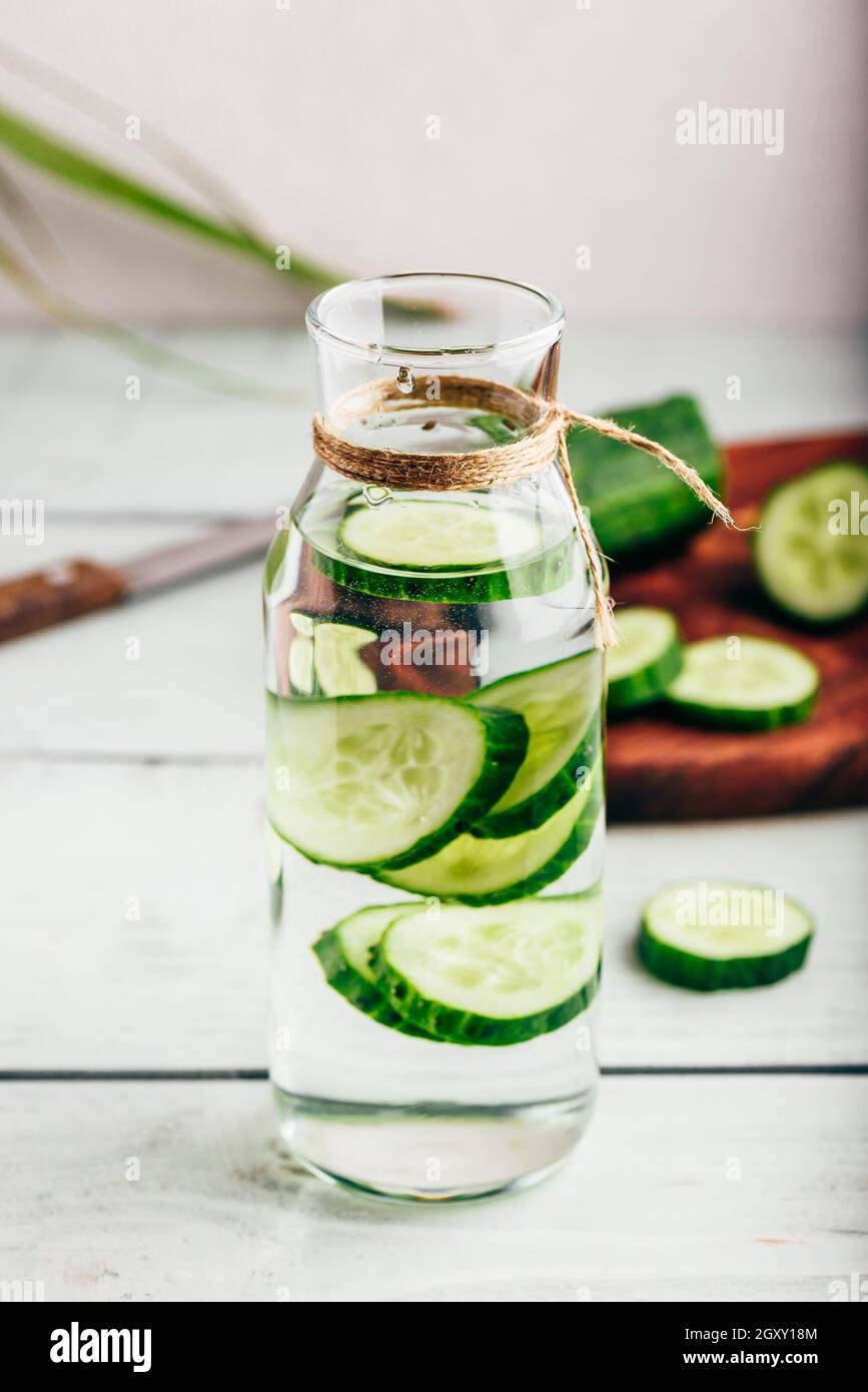 Infusion with sliced cucumber in glass bottle Stock Photo - Alamy