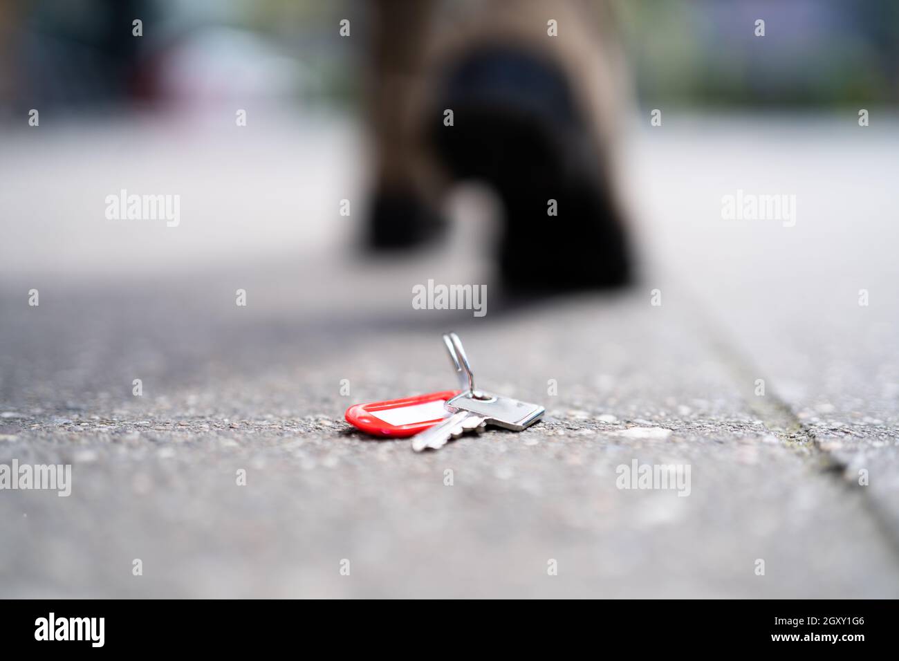 Woman Lost House Keys. Walking On Street Stock Photo - Alamy