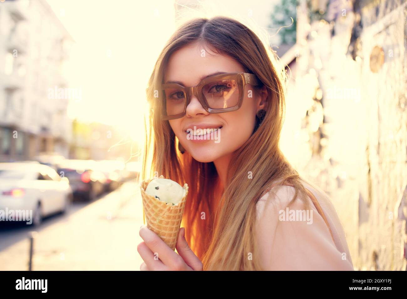 attractive woman outdoor walk eat ice cream walk travel fun Stock Photo ...