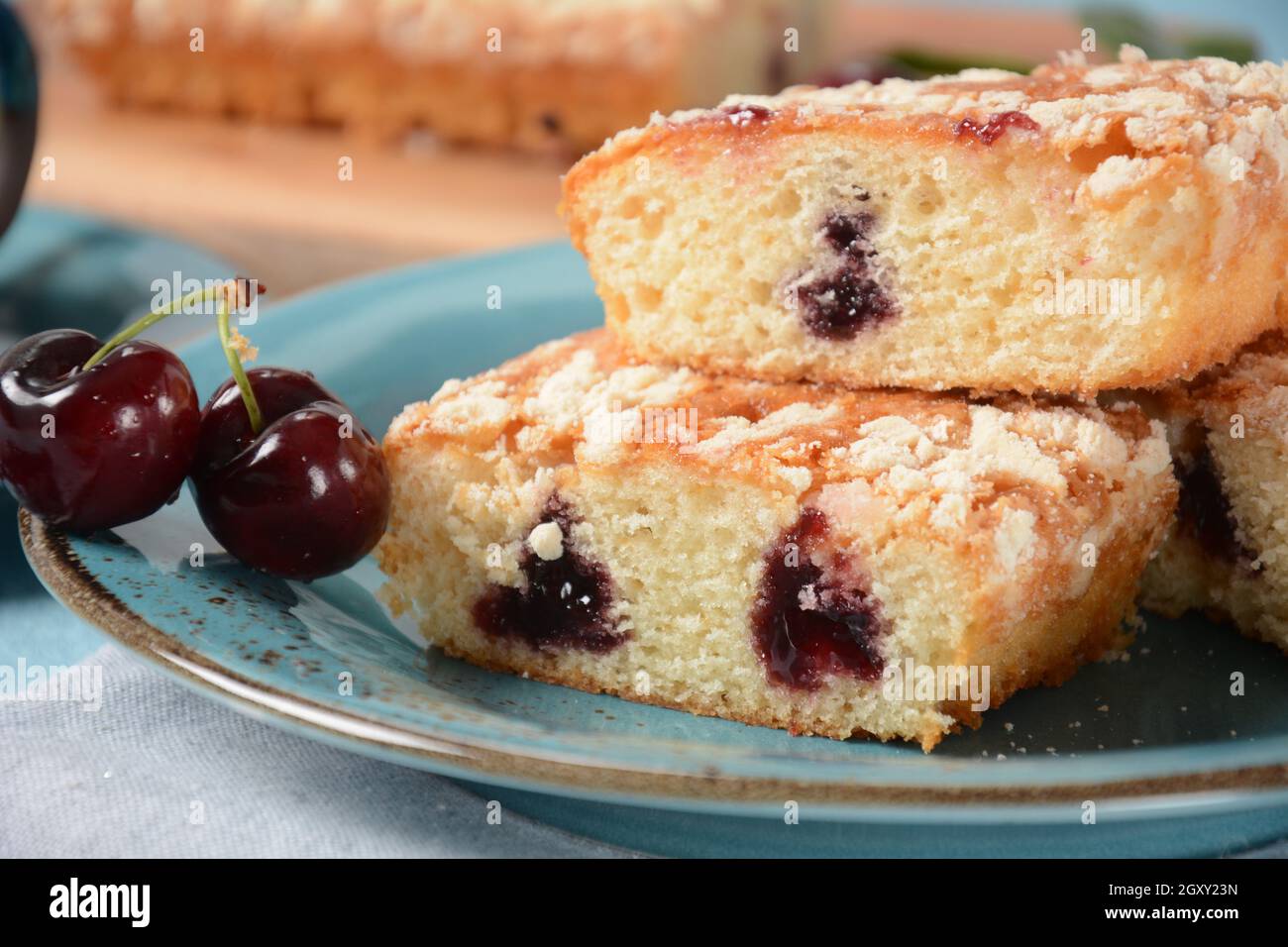German cherry cake with vanilla and icing sugar, with glaze, served and ...