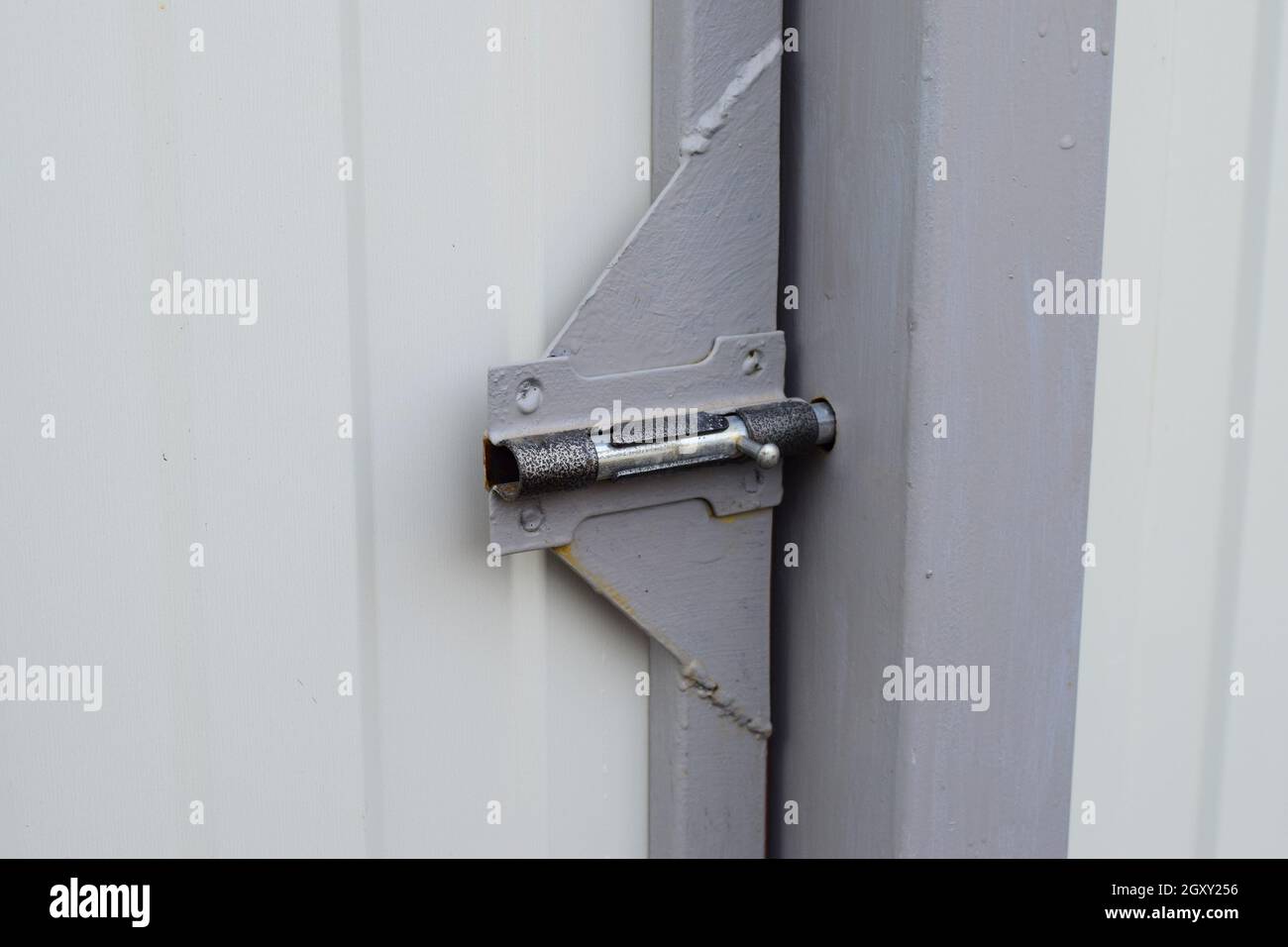 Latch on gate. A design for locking of gate from within Stock Photo - Alamy