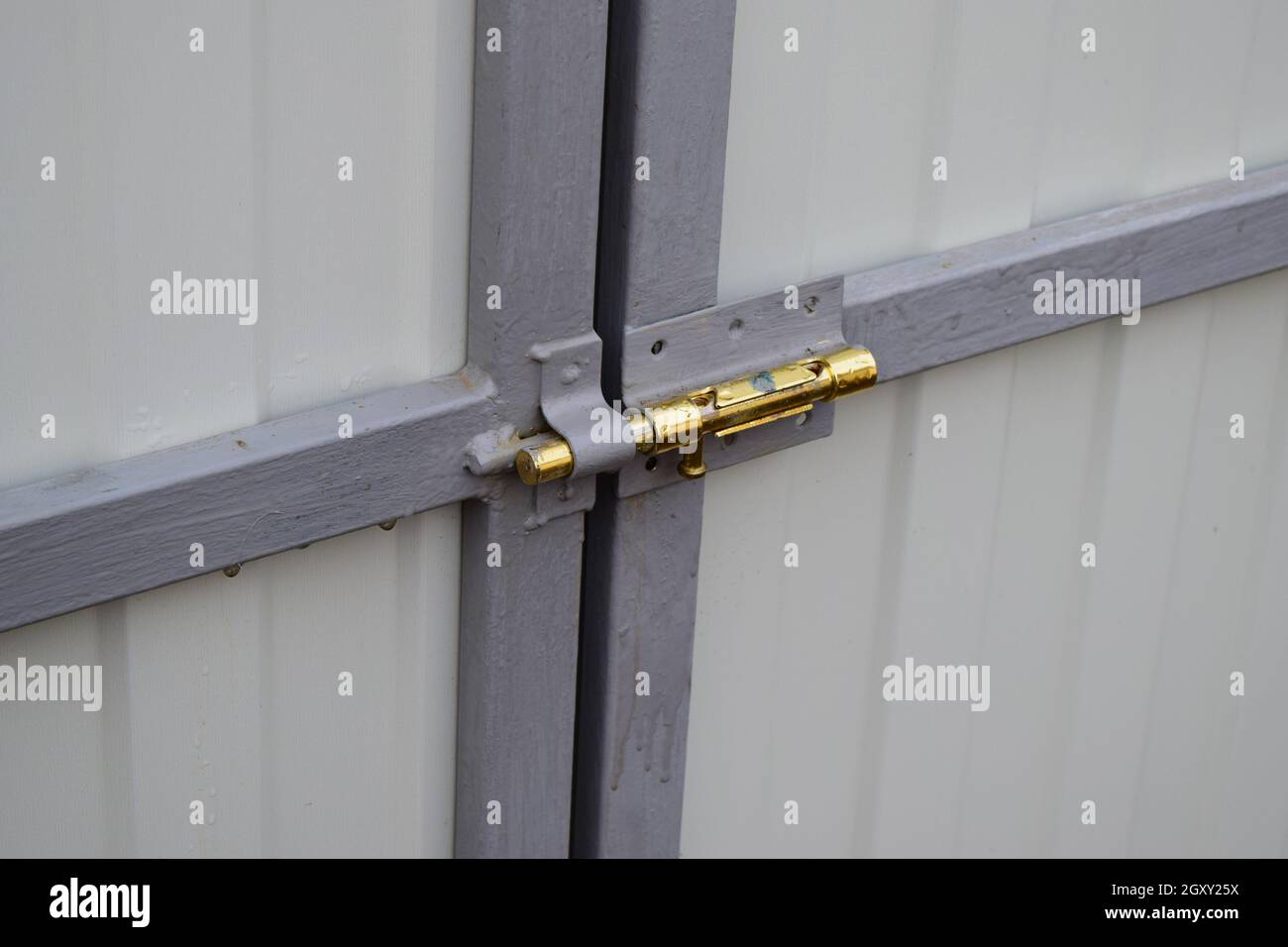 Latch on gate. A design for locking of gate from within Stock Photo - Alamy