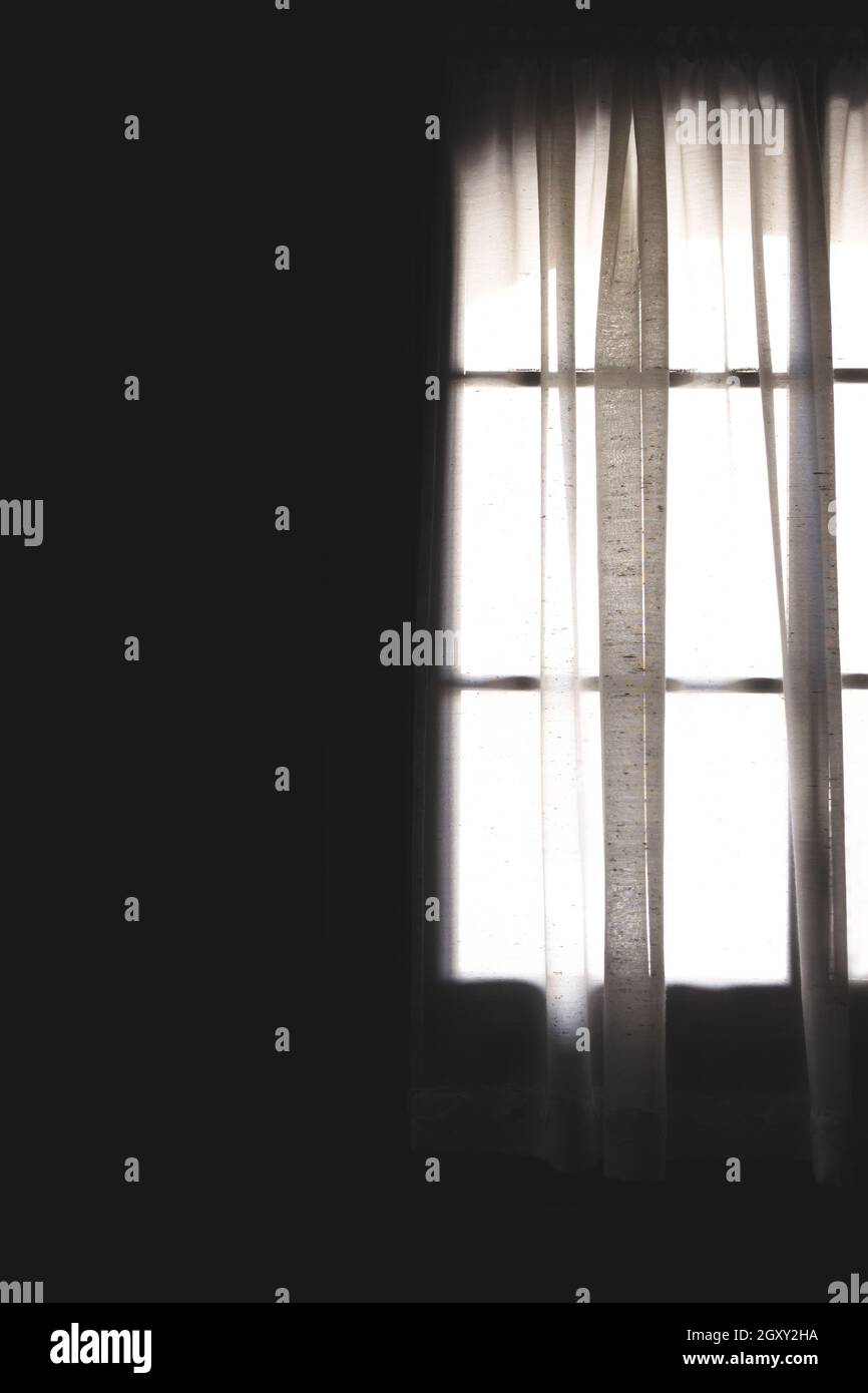 Transparent curtain with big window behind taken from room interior ...