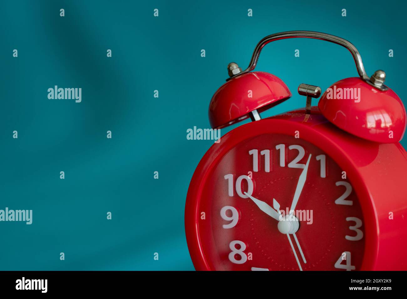 Closeup on clockwise. Face of red Alarm clock at 10 O'clock Stock Photo ...