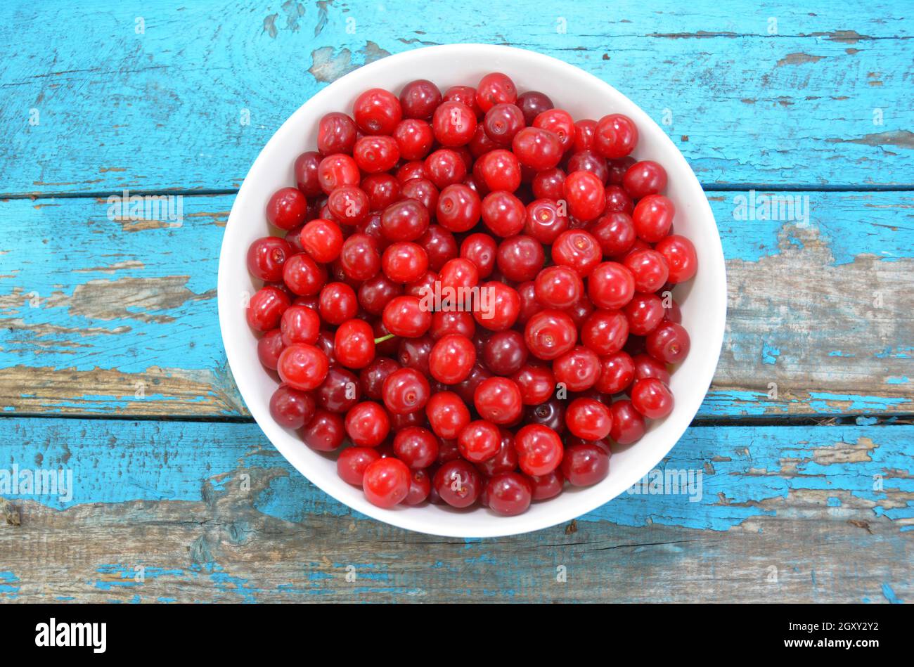 Fresh Cherries in color bowl Stock Photo - Alamy