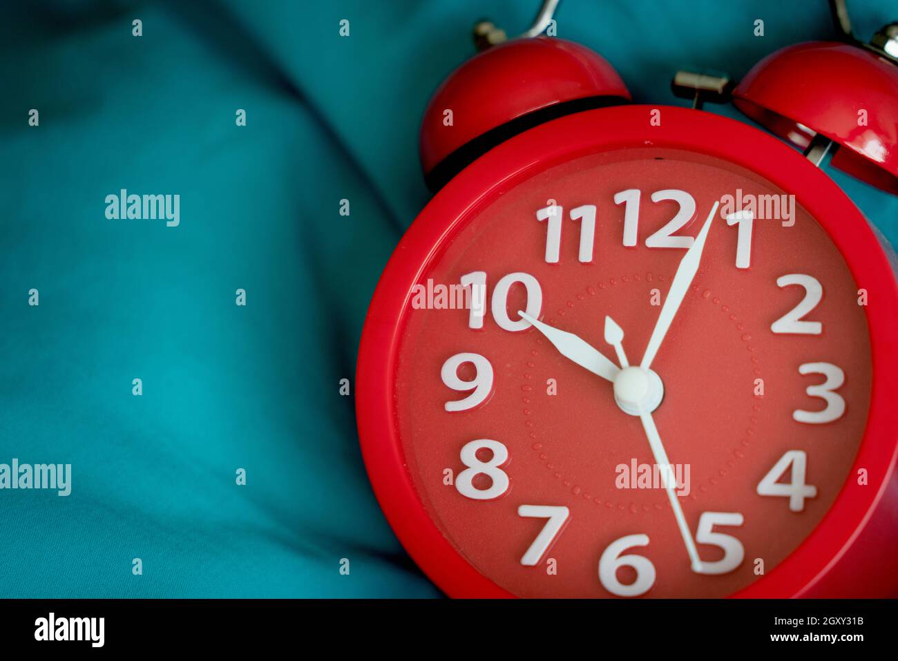 Closeup on clockwise. Face of red Alarm clock at 10 O'clock Stock Photo ...