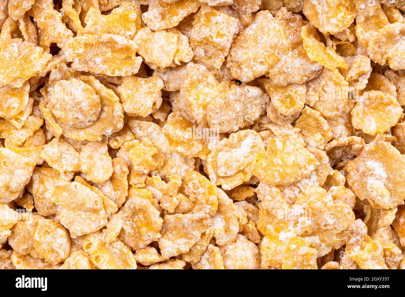 food background - raw sugar coated cornflakes Stock Photo - Alamy