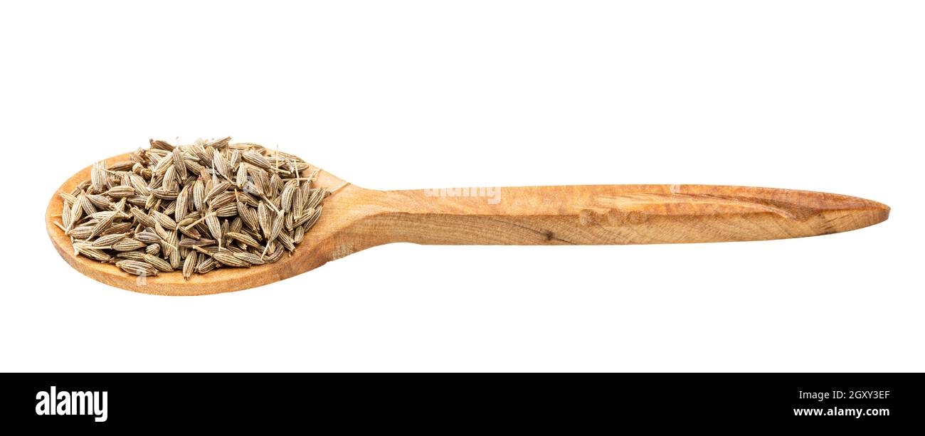 wooden spoon with cumin (cuminum cyminum) seeds isolated on white ...