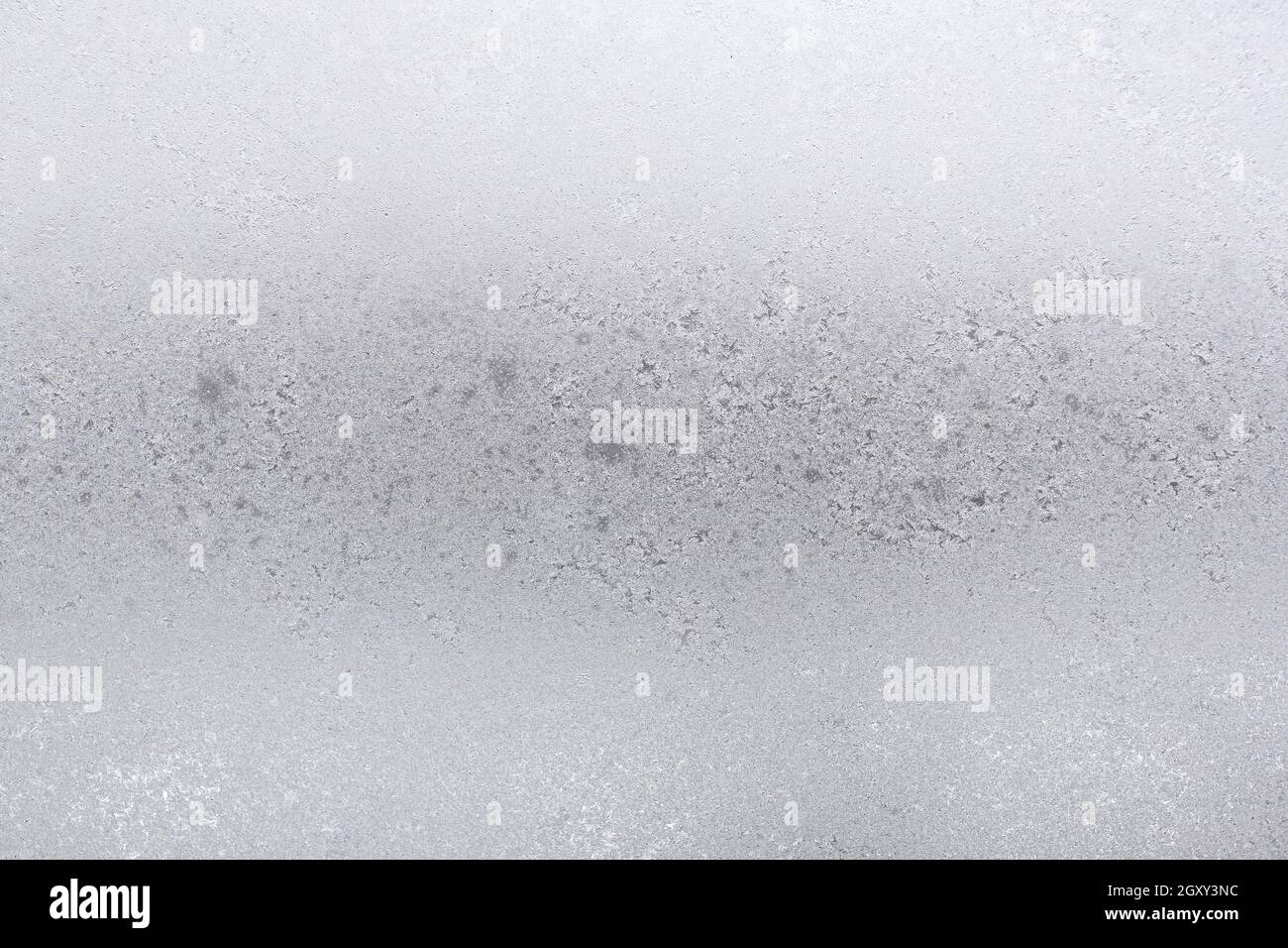 frost on surface of home window in urban houses in city on overcast ...
