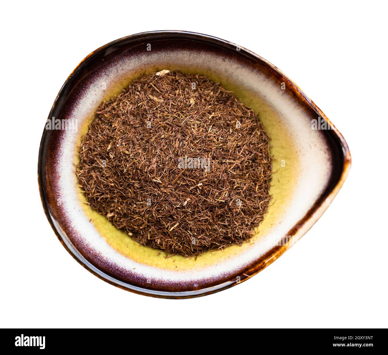 top view of grinded dried corn silk in ceramic bowl isolated on white ...