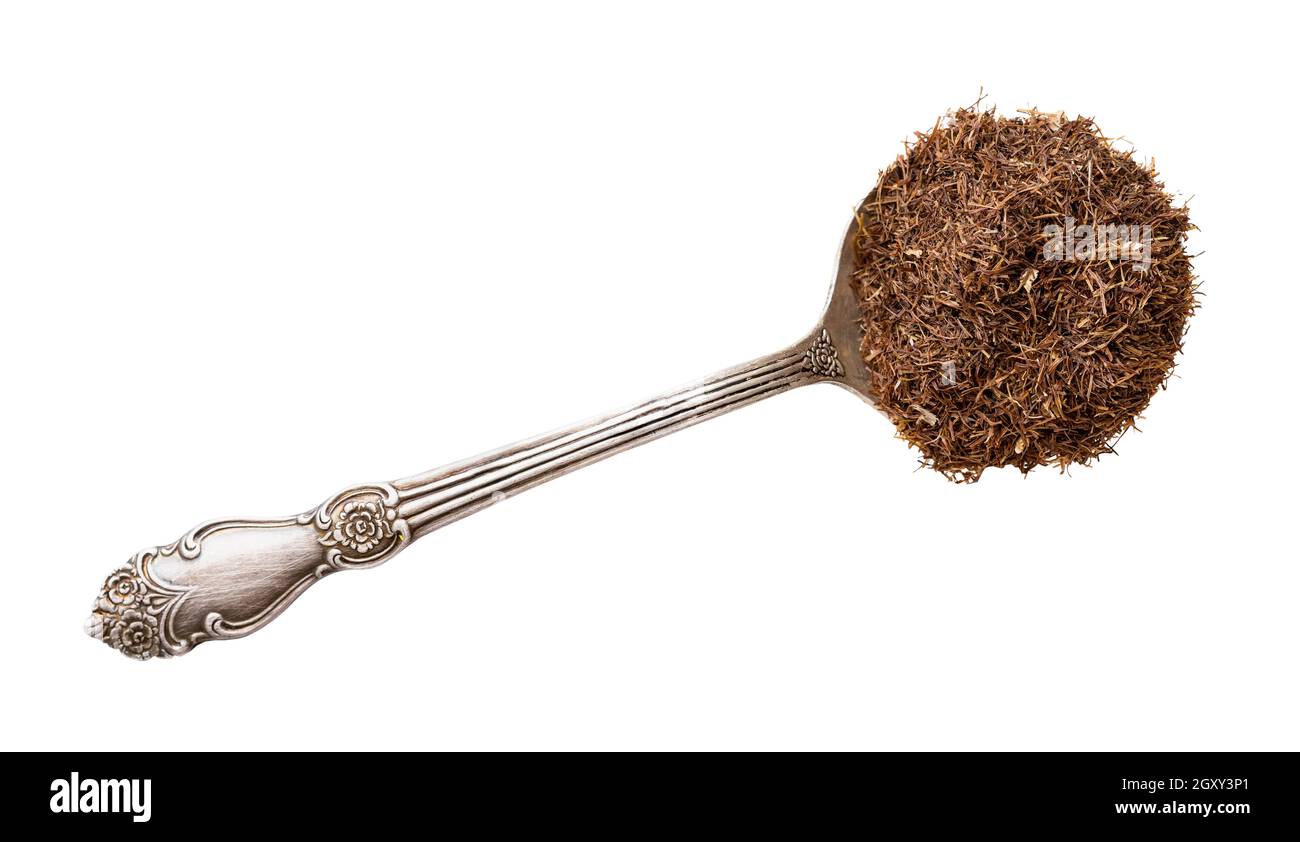 top view of grinded dried corn silk in silver tablespoon isolated on ...