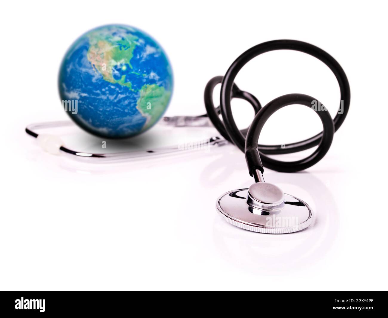 Medical concept with stethoscope and planet Earth over white background ...