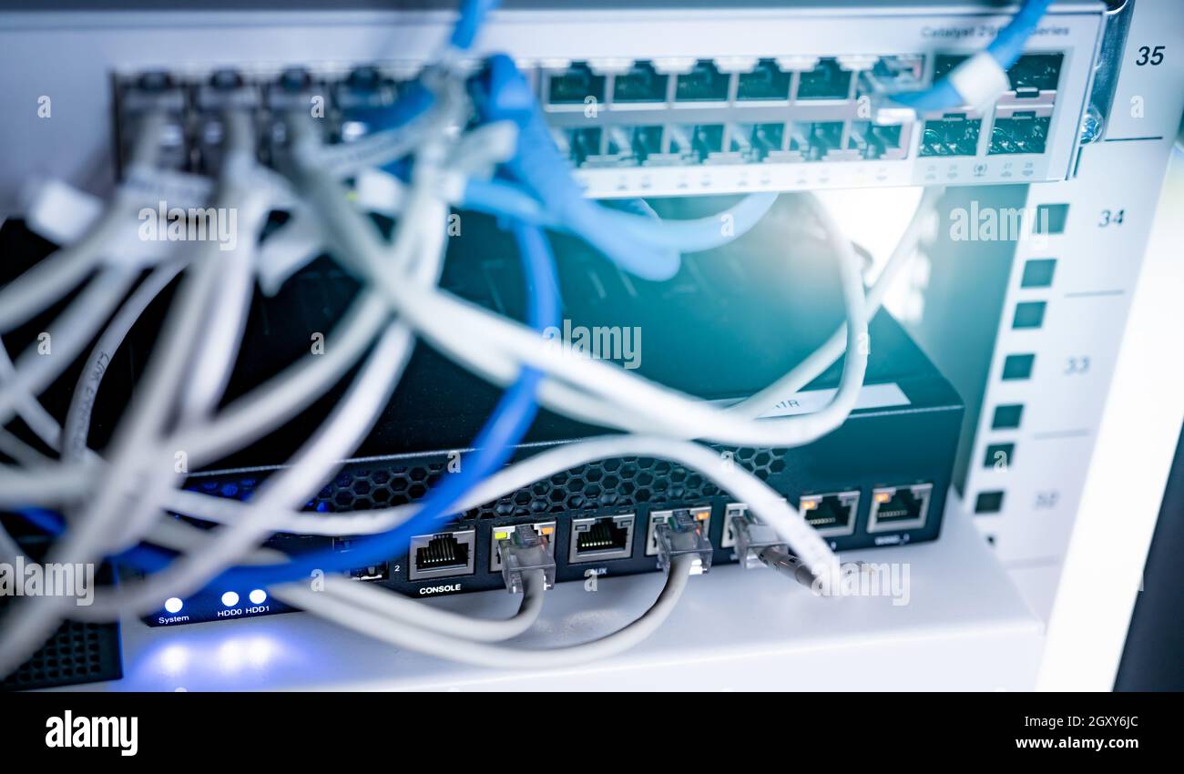 Network switch and ethernet cable in data center. Wifi plug of internet ...