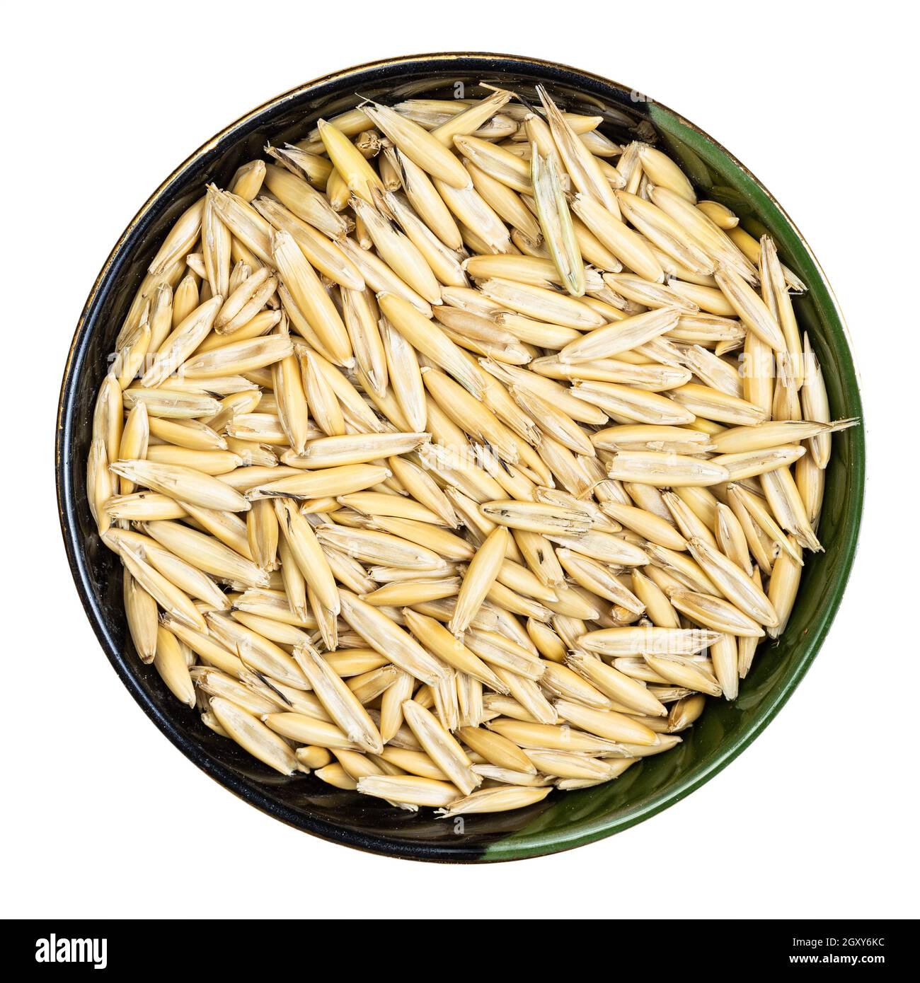 top view of unhulled common oat grains in round bowl isolated on white ...