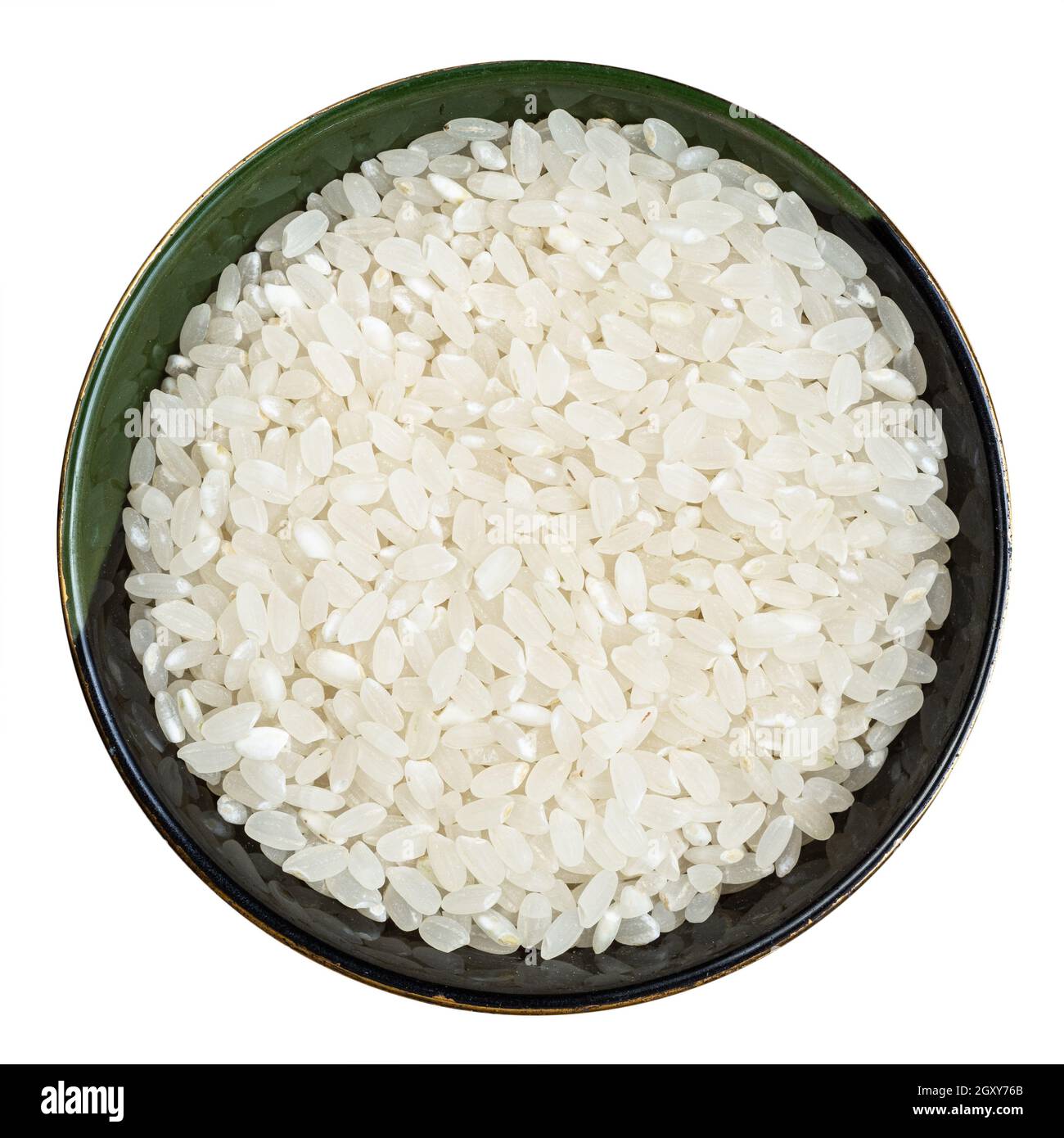 top view of polished medium-grain rice in round bowl isolated on white ...