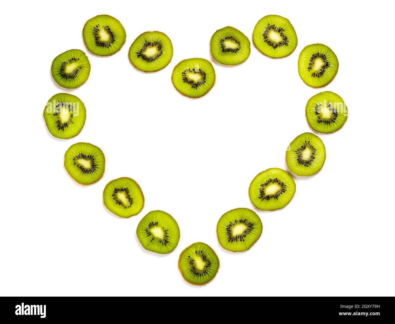 Kiwi thin slices in heart shape on white, pattern for textured ...