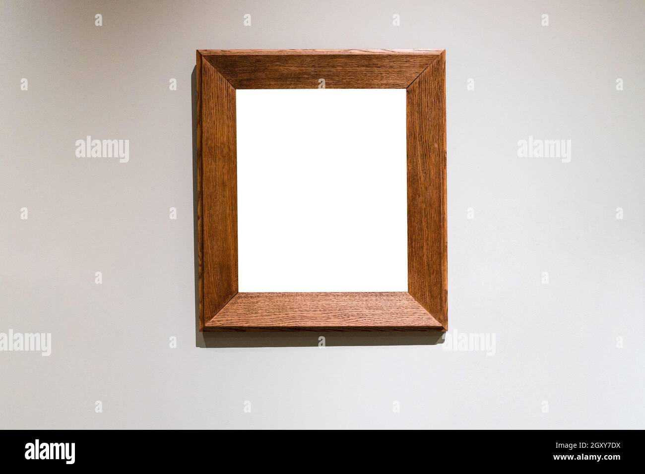 flat wide vertical wooden picture frame with cutout canvas on gray wall ...