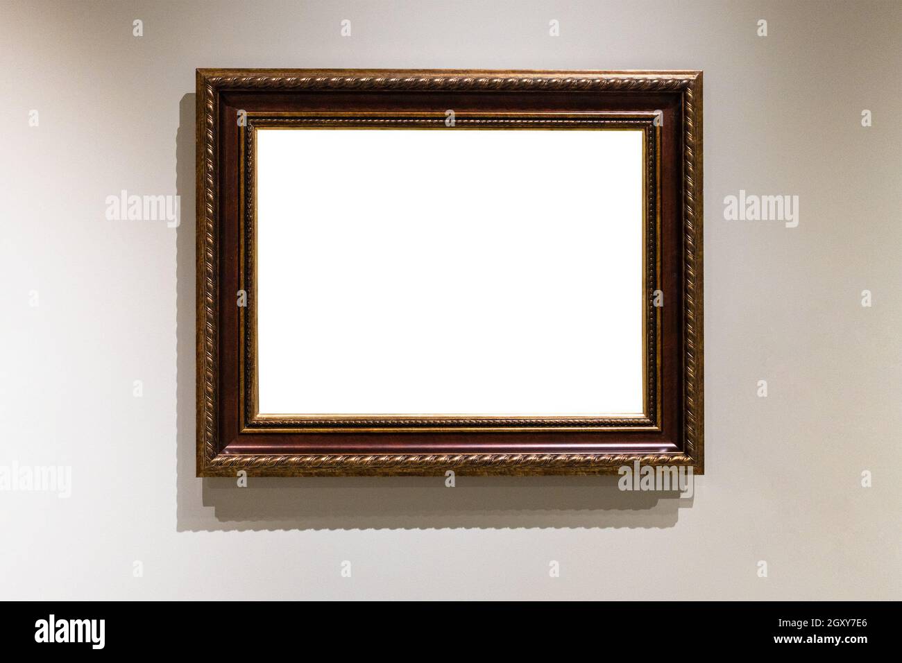 wide dark brown wooden picture frame with cutout canvas on gray wall ...