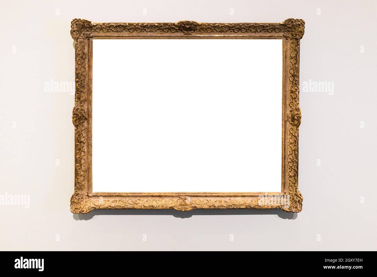 old decorated narrow picture frame with cutout canvas on gray wall ...