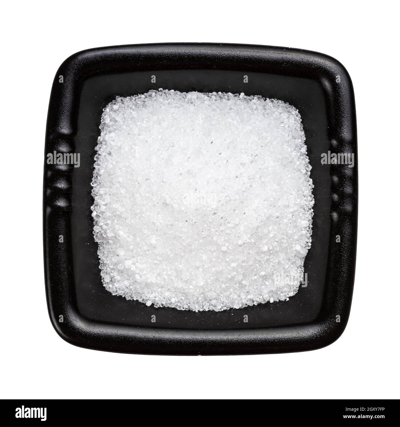 top view of crystalline citric acid in black bowl isolated on white ...