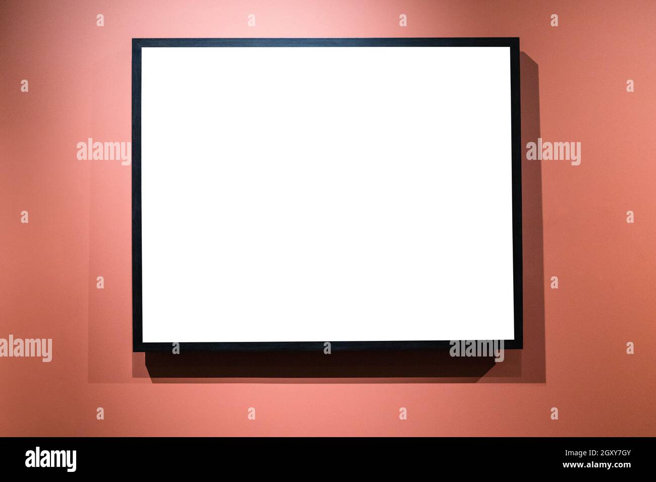 narrow black picture frame with cutout canvas on red wall Stock Photo ...