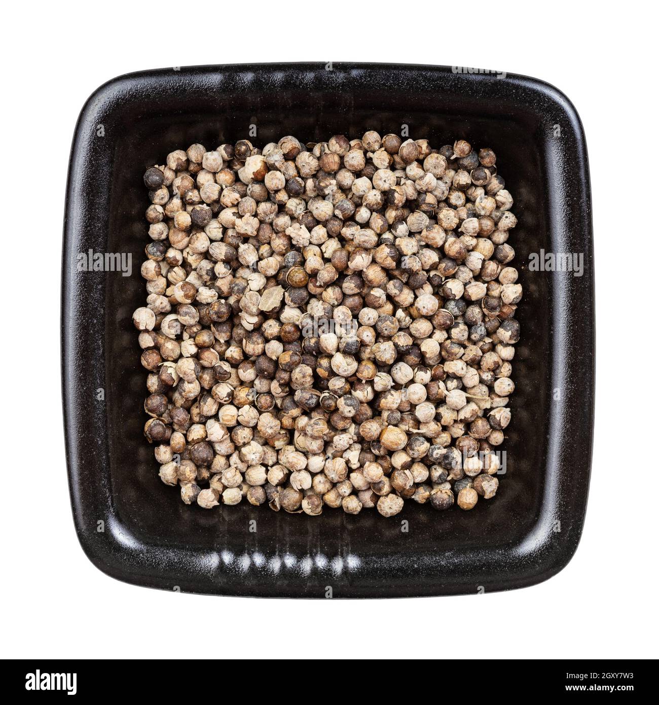 top view of monk's pepper (vitex) in black bowl isolated on white ...