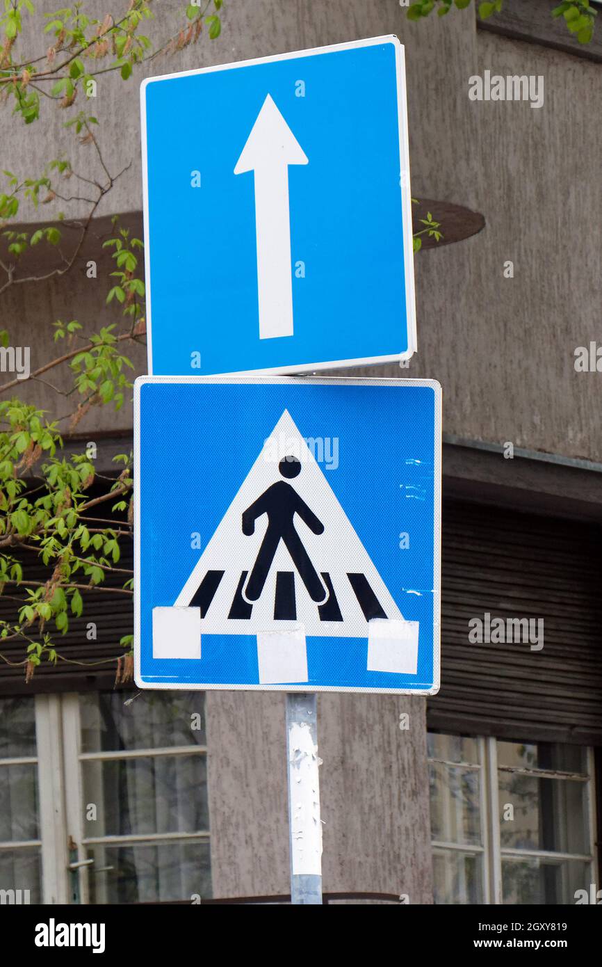 Zebra crossing traffic sign with direction arrow in urban street Stock ...