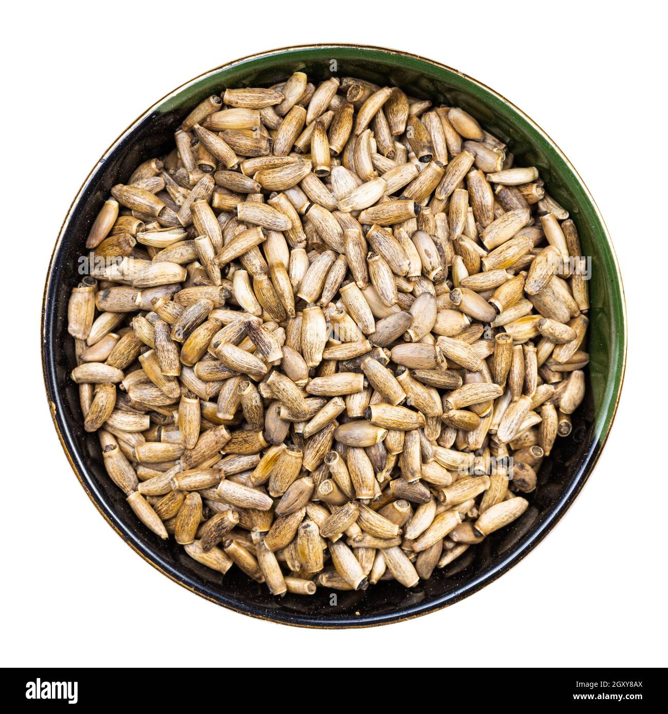 top view of whole milk thistle seeds in round bowl isolated on white ...