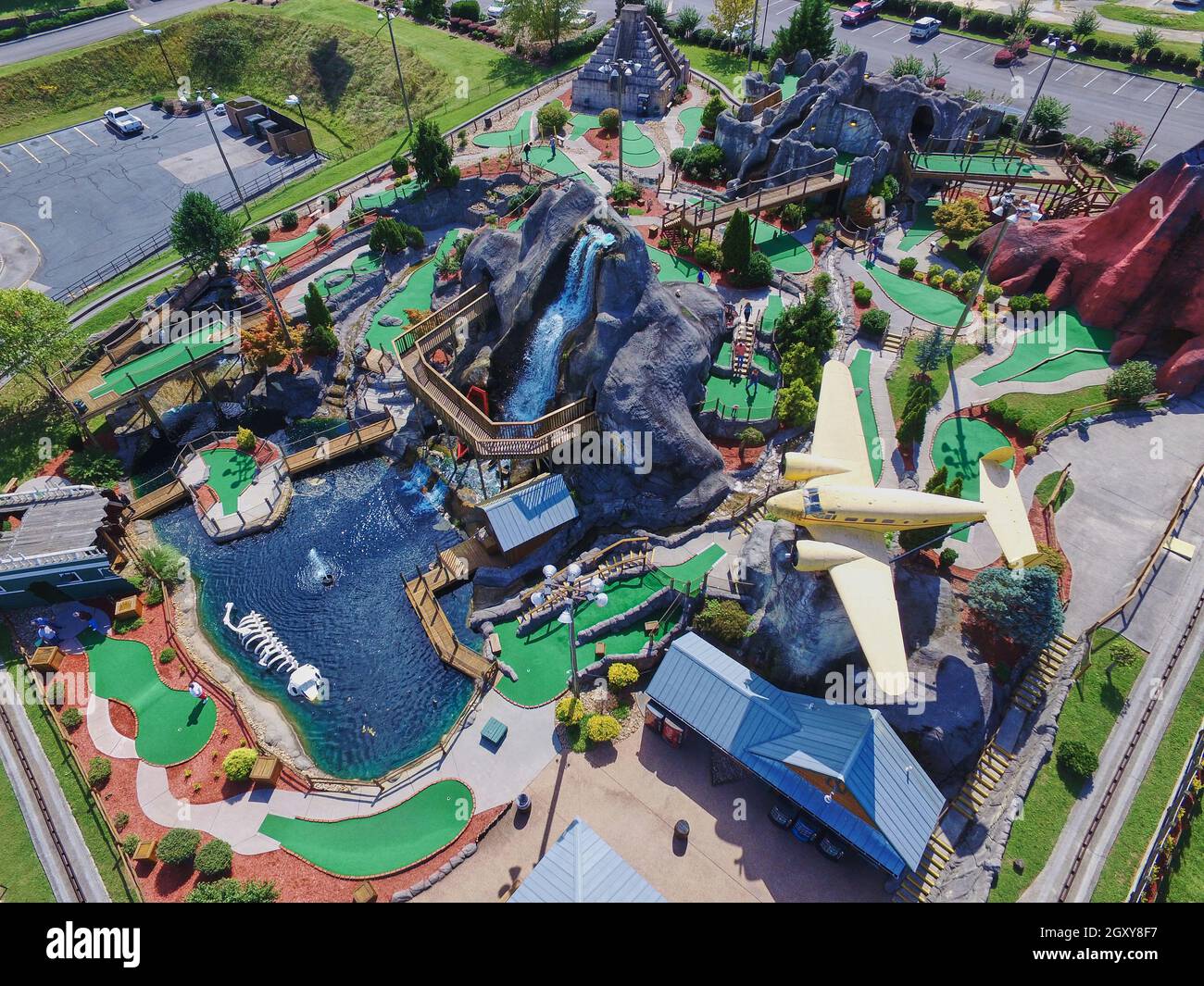 Aerial shot of a putt-putt course with various kitschy decorations ...