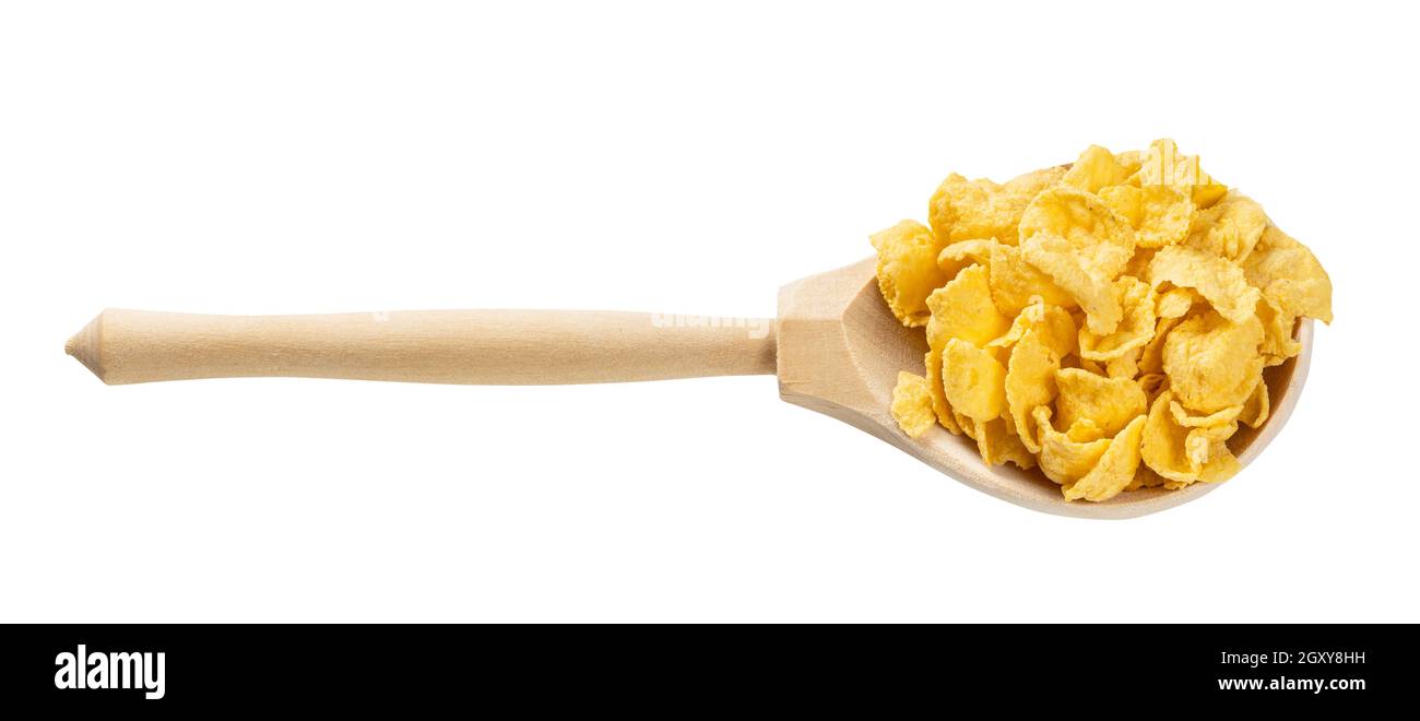 wooden spoon with sugar-free corn flakes isolated on white background ...