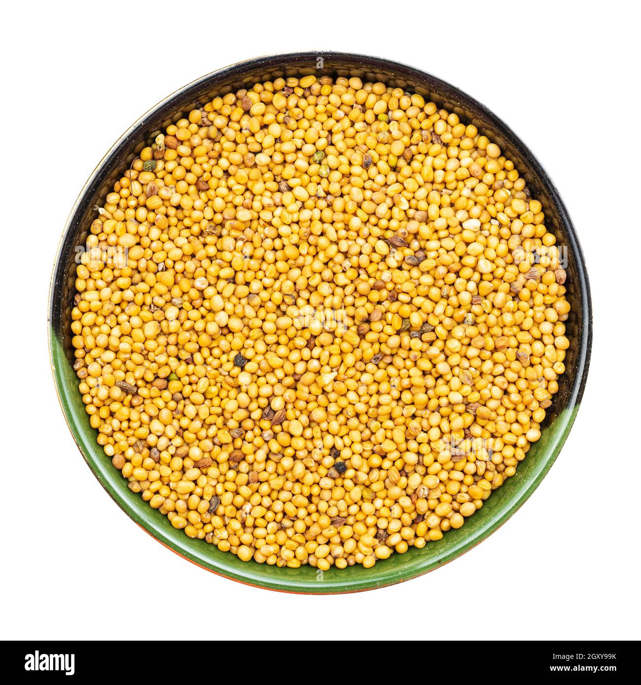 top view of yellow seeds of Sinapis Alba mustard in round bowl isolated ...