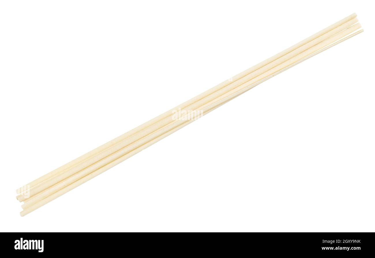 few dried round Udon noodles from wheat flour isolated on white ...